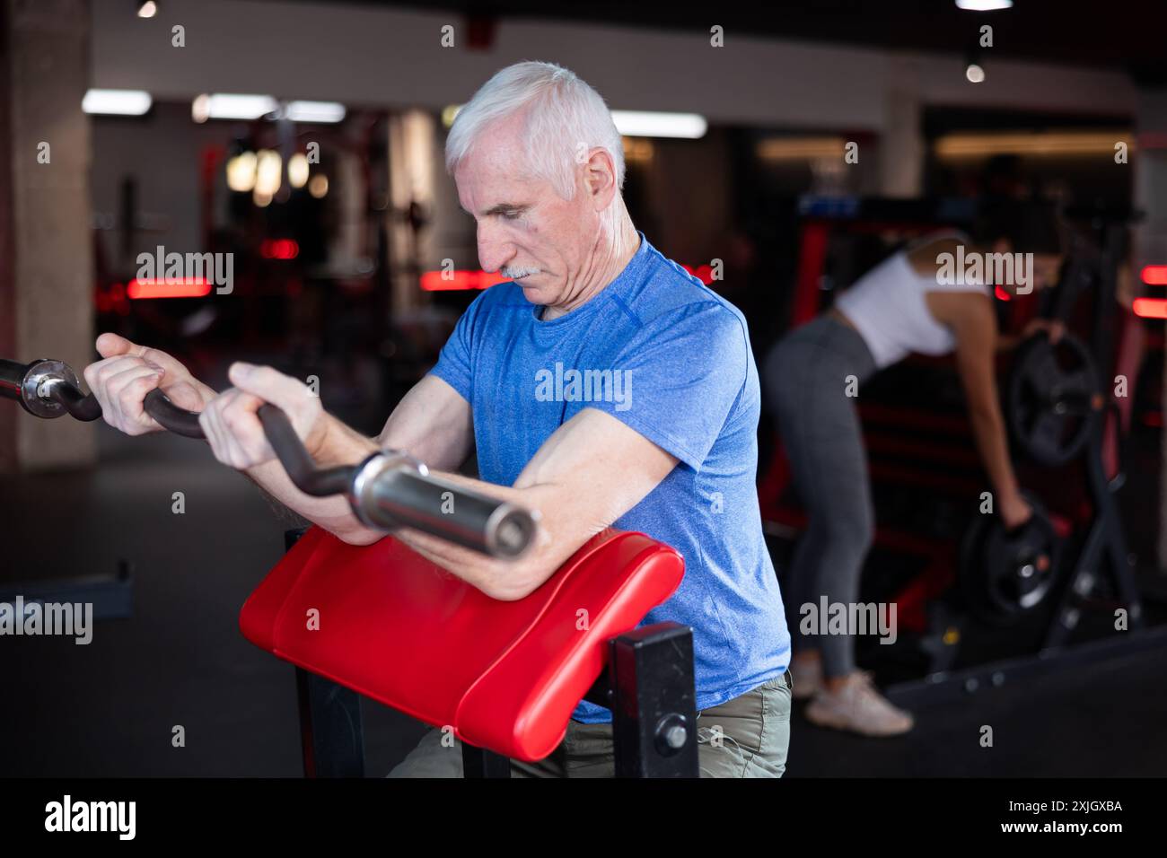 Active man during exercises to strengthen muscles of hands and body ...