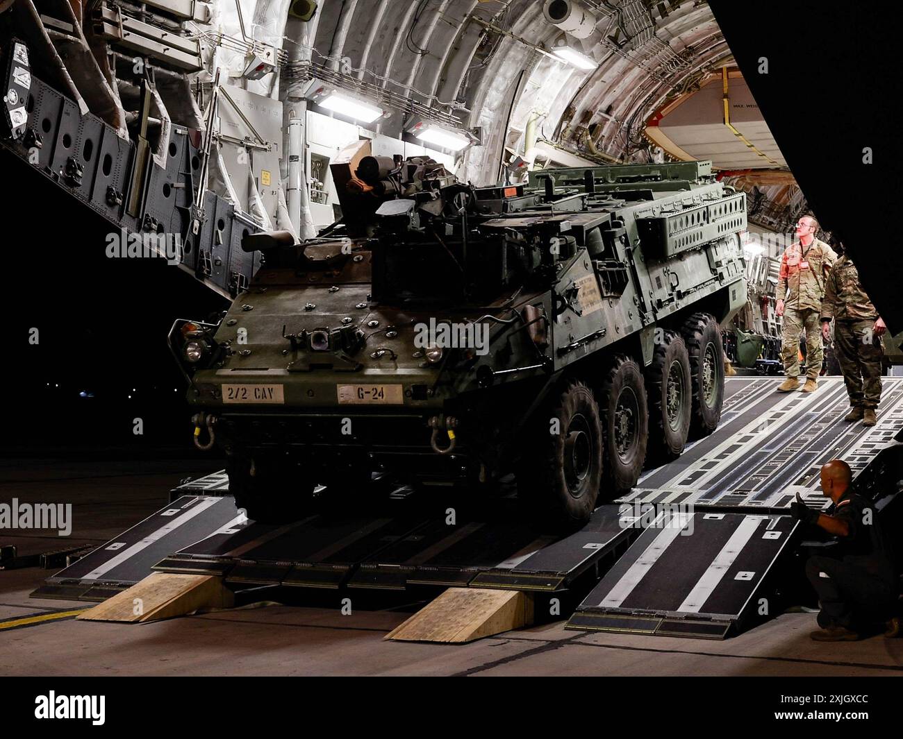 A crew member from a Heavy Airlift Wing (HAW) aircraft, a part of the ...