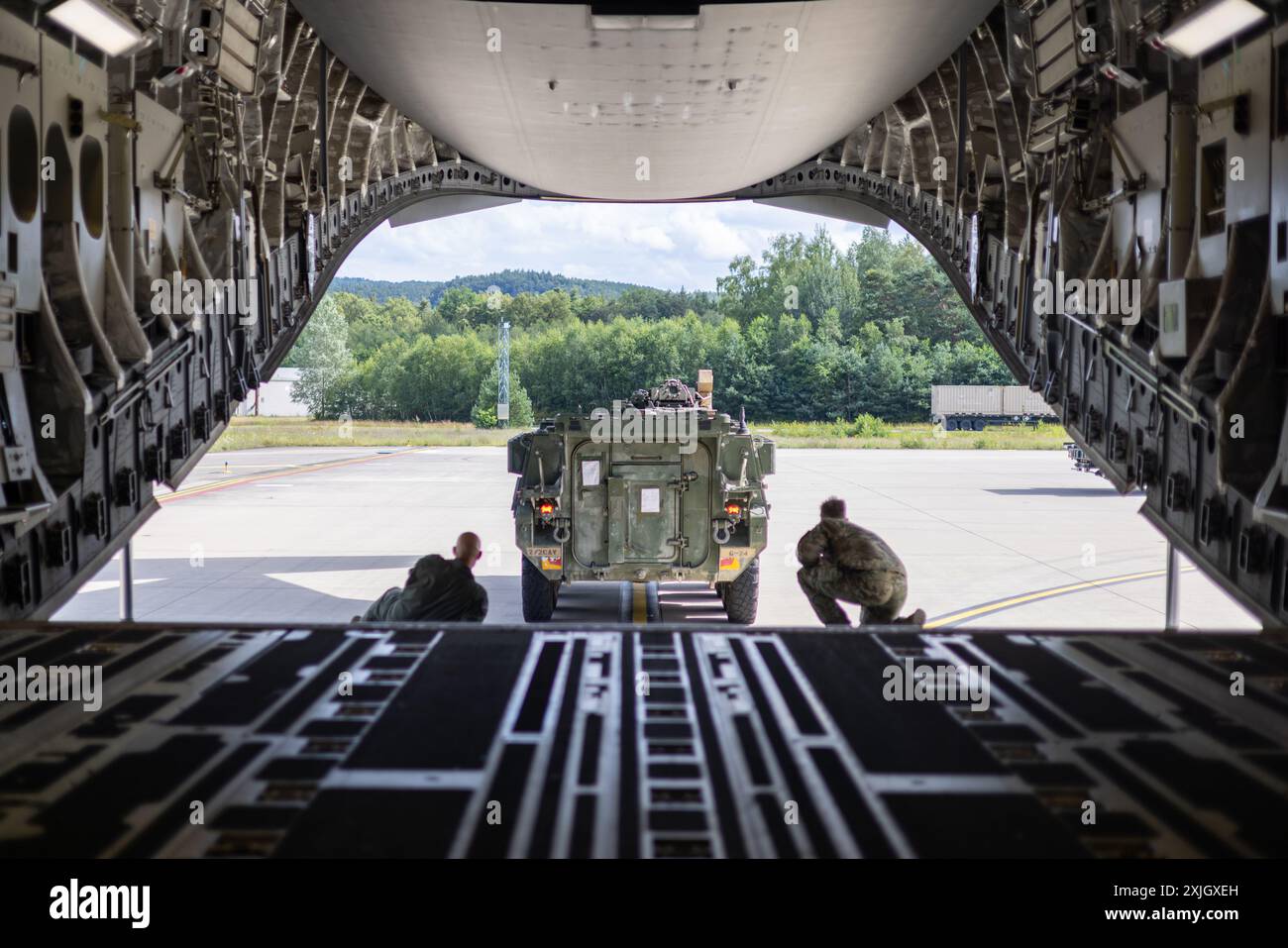 U.S. Soldiers load an M1126 Stryker Combat Vehicle onto a C-17 ...
