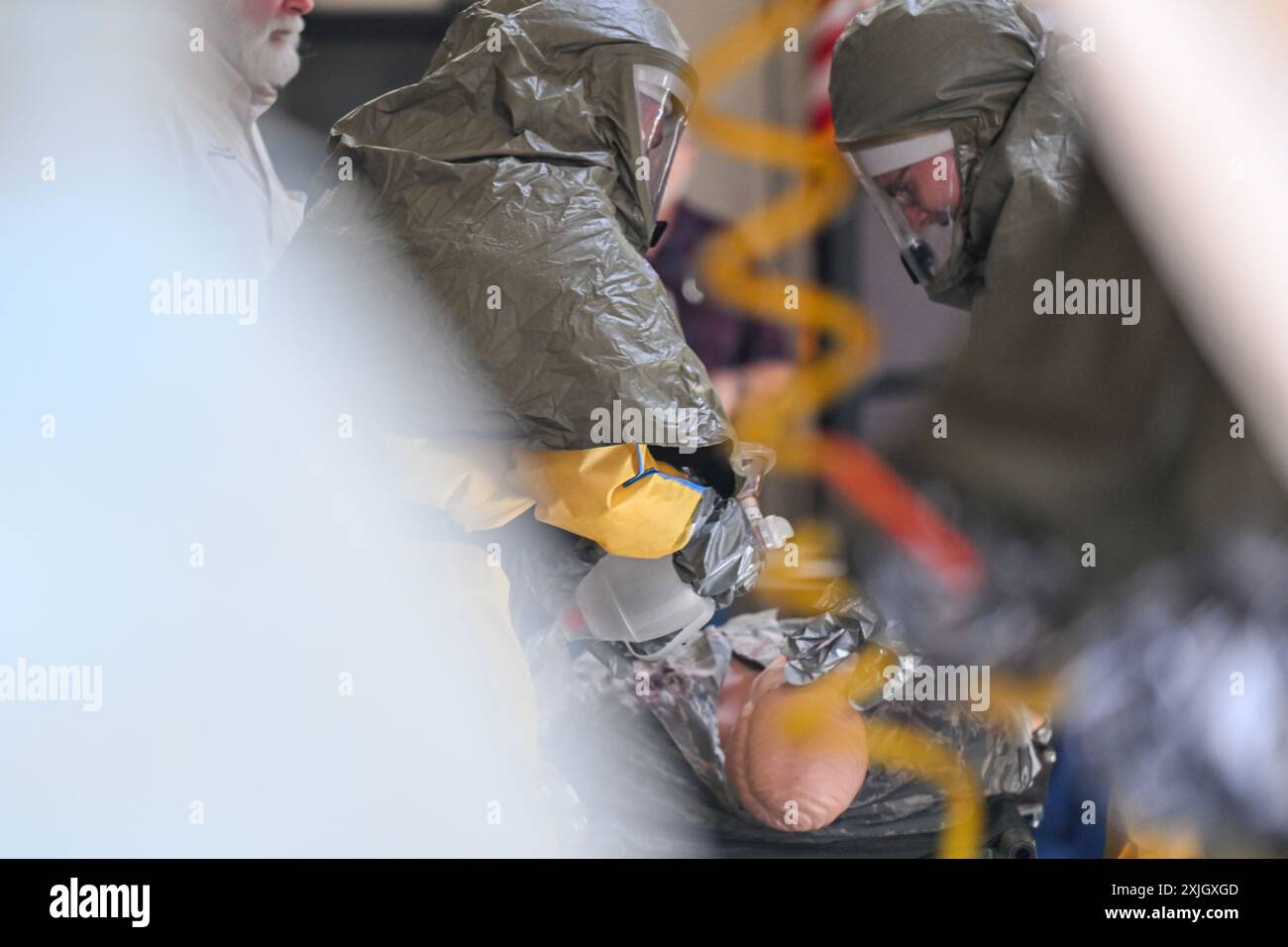 Airmen from the 75th Medical Group triage a simulated contaminated ...