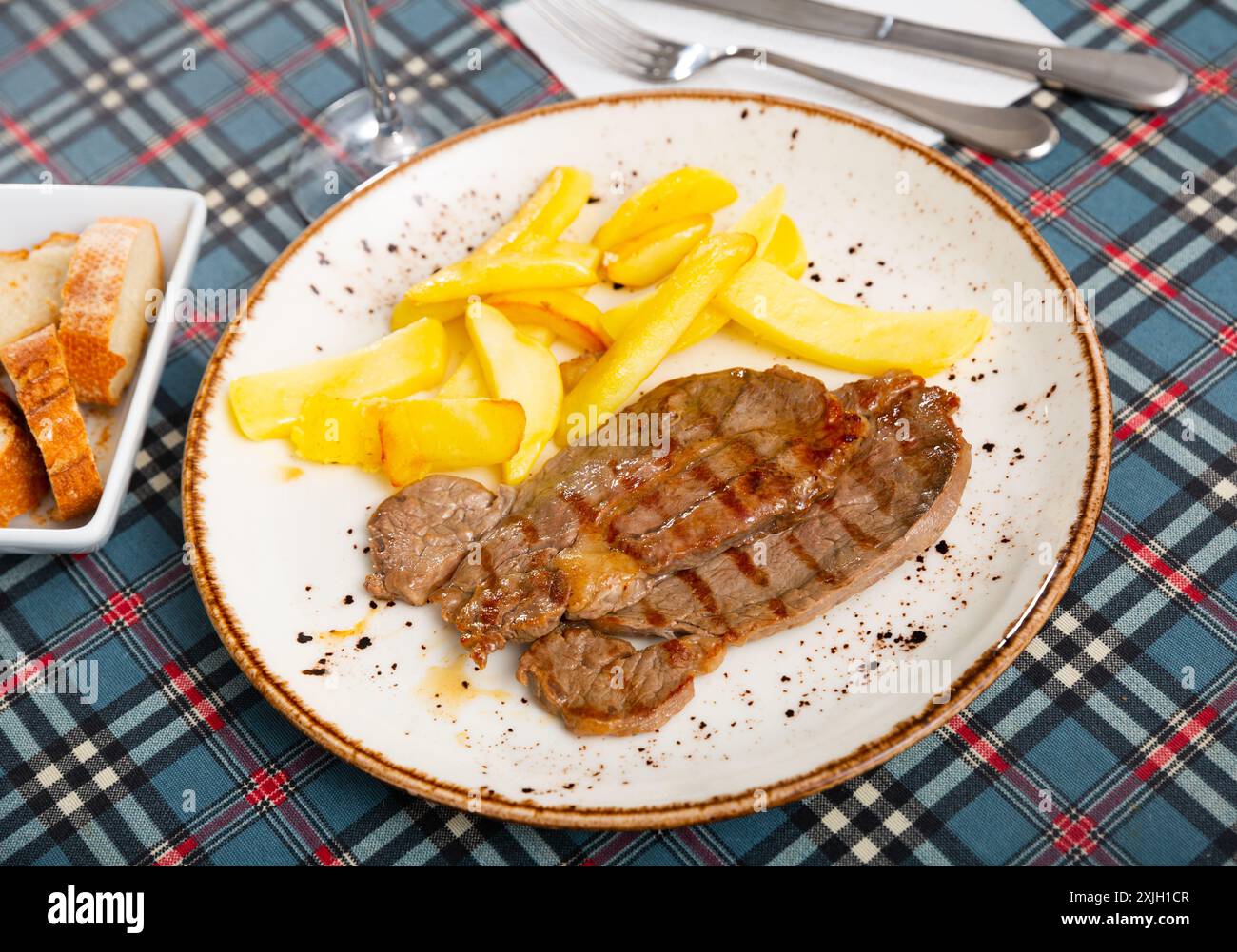 Traditional spanish grilled beef with potato Stock Photo - Alamy
