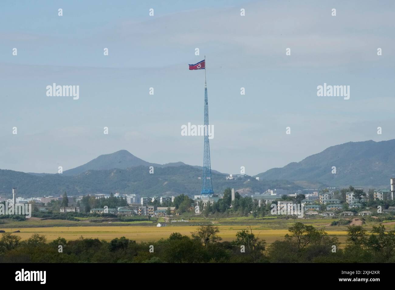 FILE - A North Korean flag flutters in the wind near the border ...