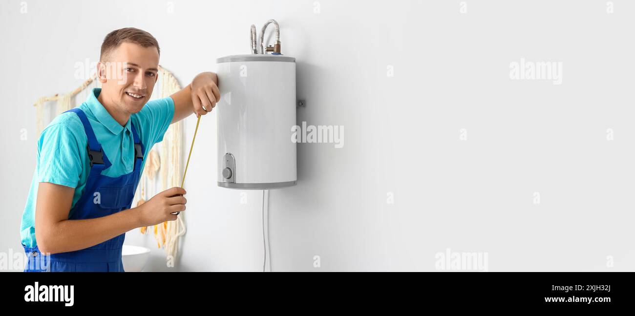 Plumber installing electric shower hi-res stock photography and images ...