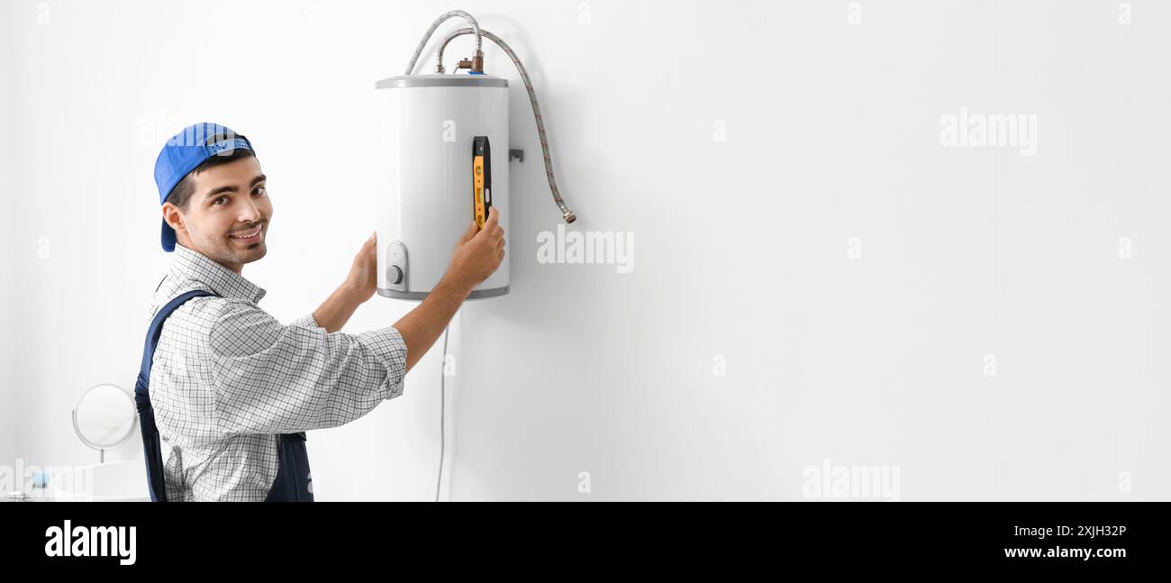 Plumber installing electric shower hi-res stock photography and images ...