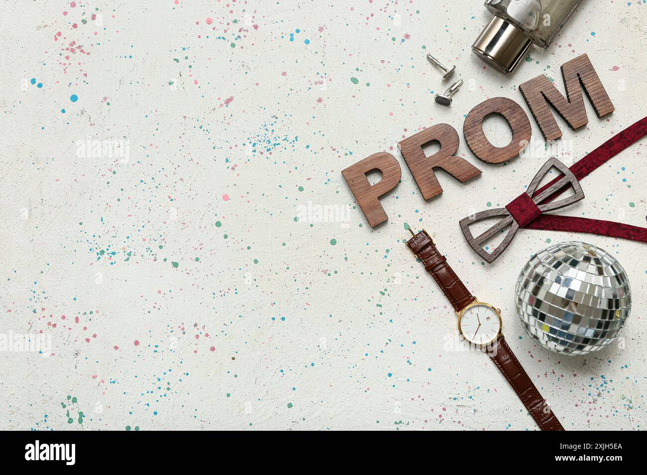 Word PROM with disco ball, wristwatch and bow tie on light grunge ...