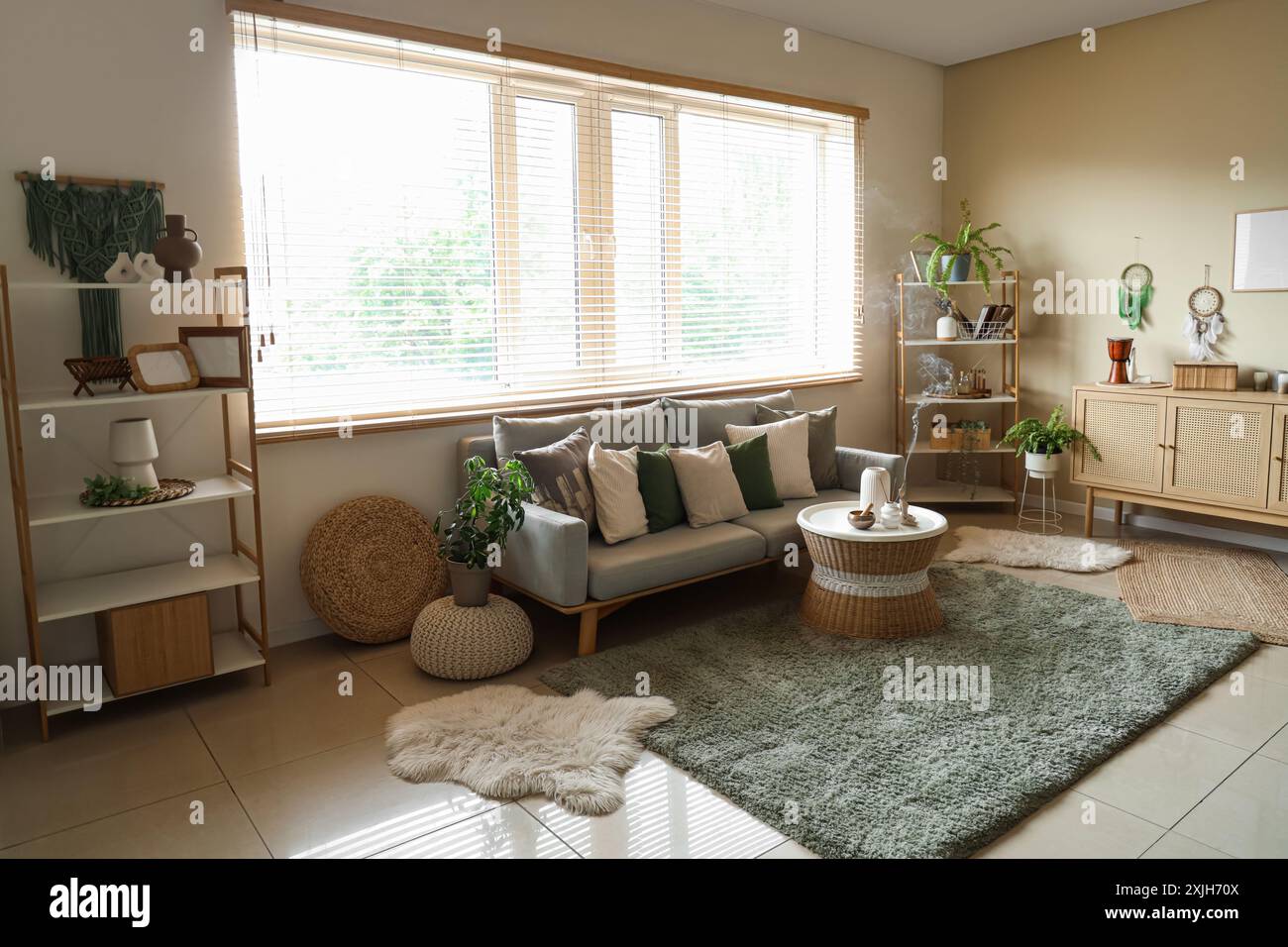 Interior of living room with witch's magic attributes, sofa and table ...