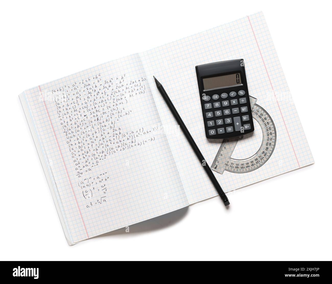Copybook with handwritten maths formulas, calculator, pencil and ruler ...