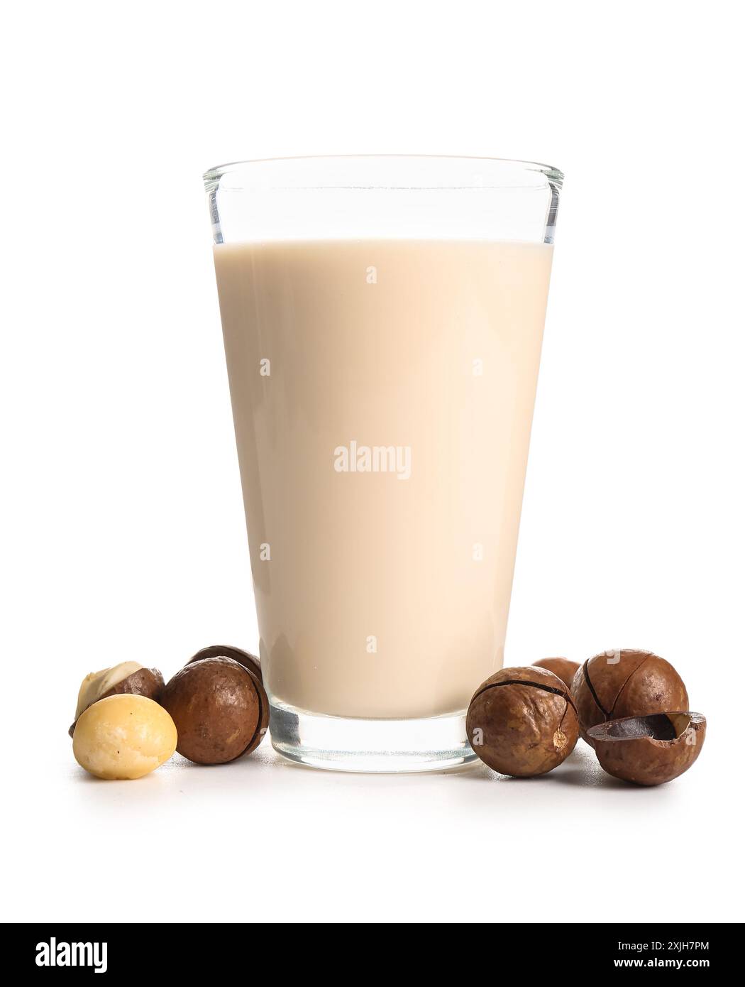 Glass of fresh macadamia milk on white background Stock Photo - Alamy