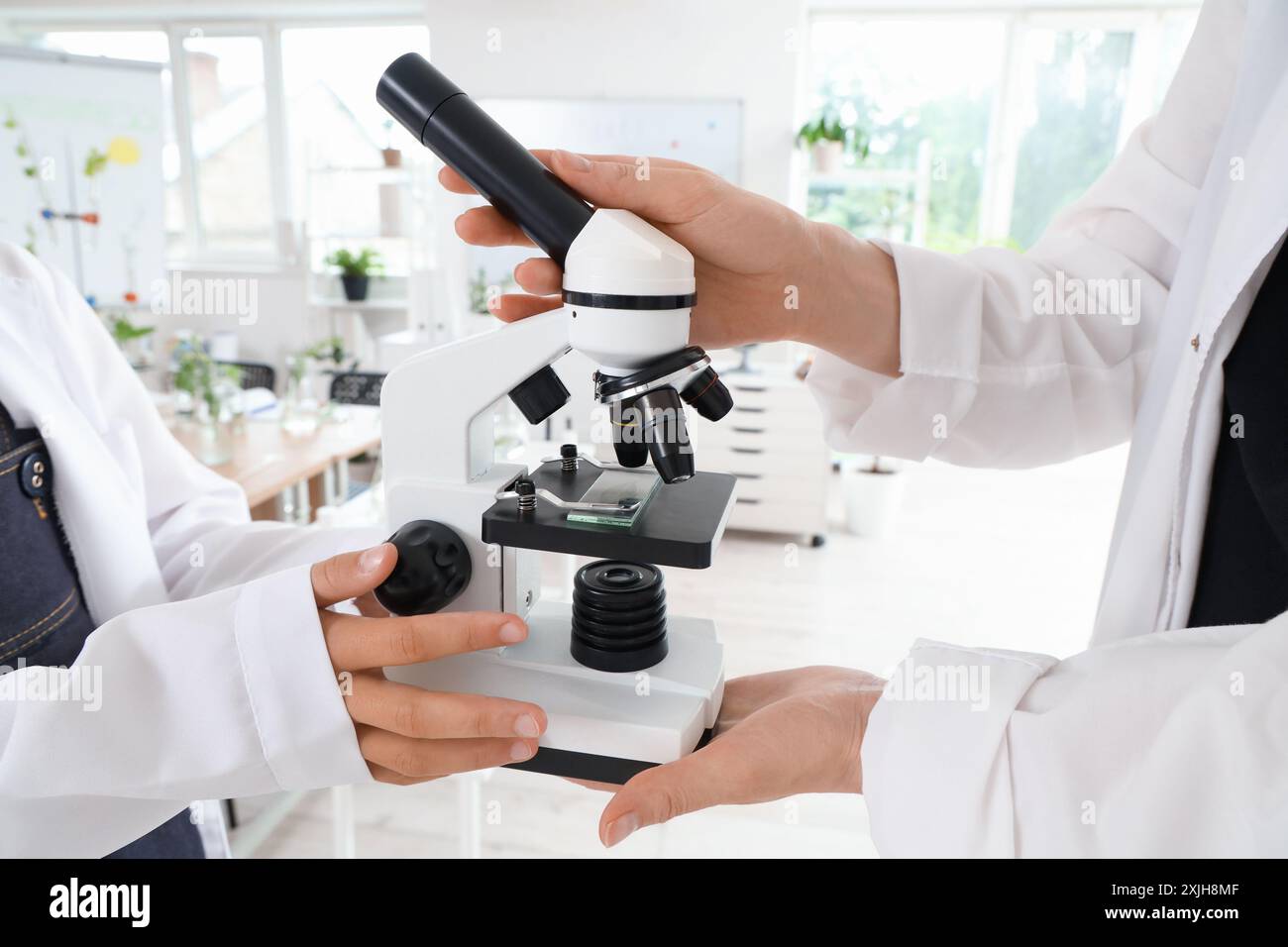 Girl microscope nature hi-res stock photography and images - Alamy