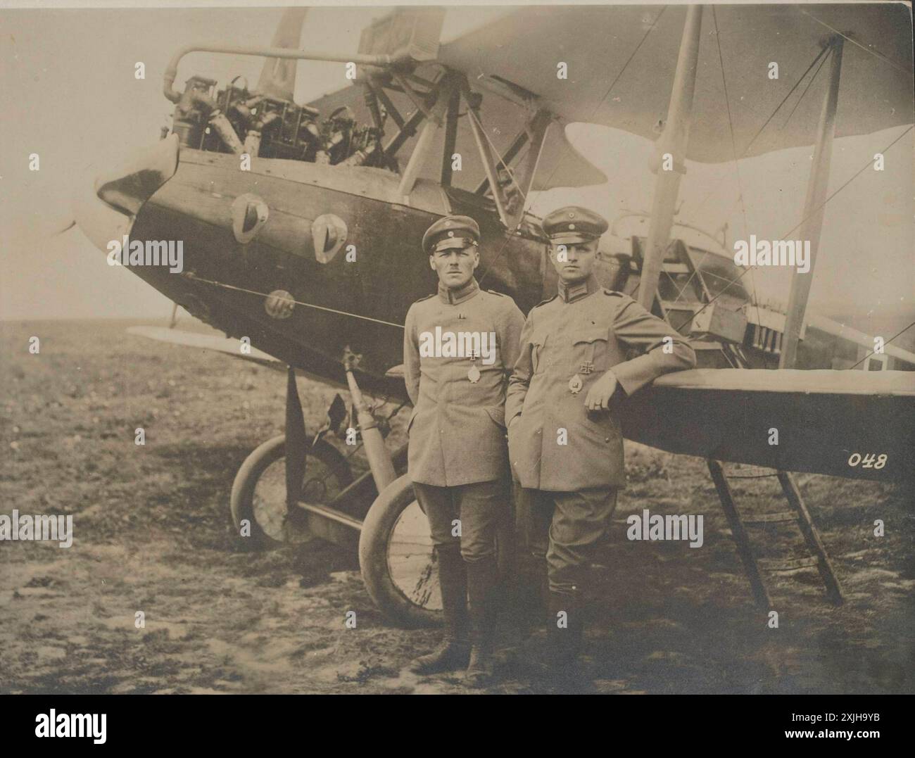Two German pilots in front of their plane during World War One, circa ...