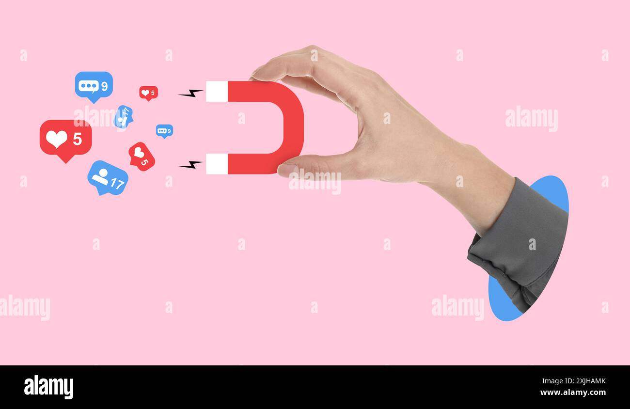 Woman attracting followers, likes and comments with magnet on pink ...