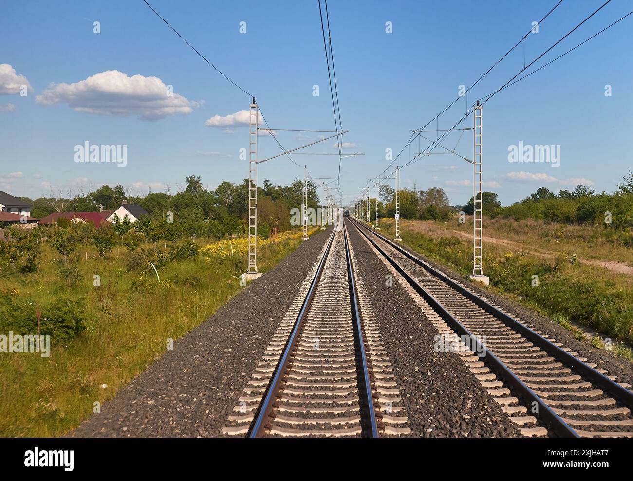 Rails with train, railway travel Stock Photo - Alamy