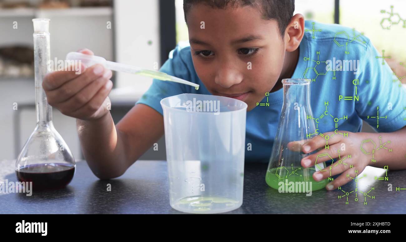 Conducting science experiment, child using pipette over chemical formulas image Stock Photo - Alamy