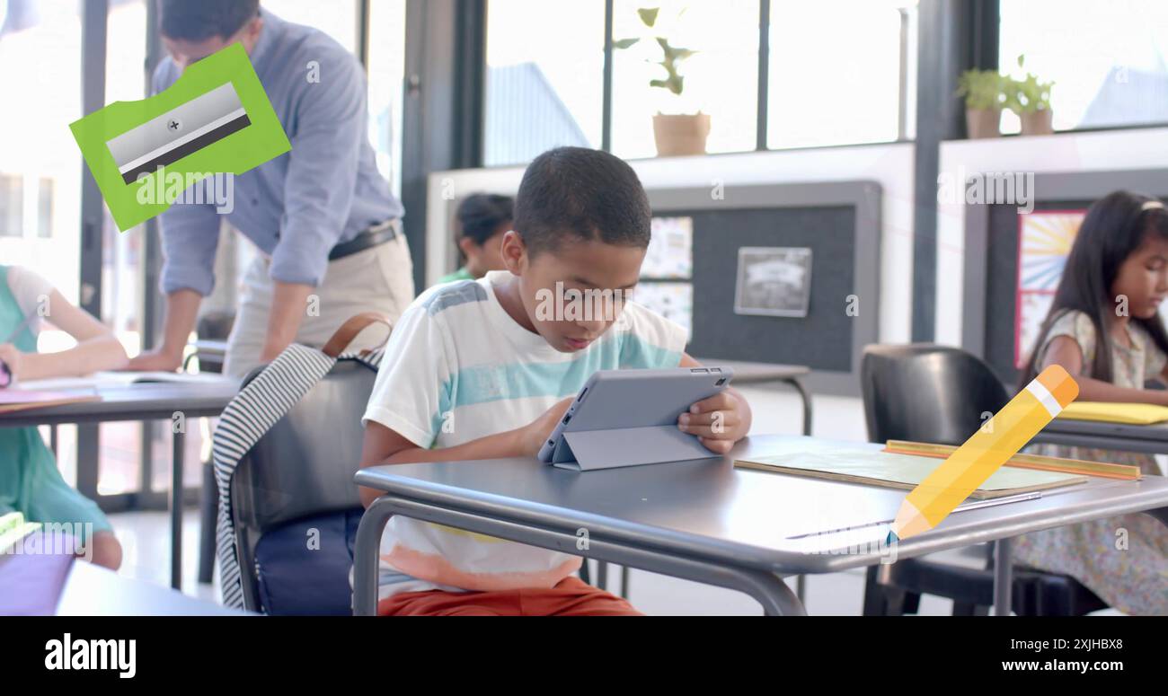 Studying with tablet, boy in classroom with image of school supplies ...