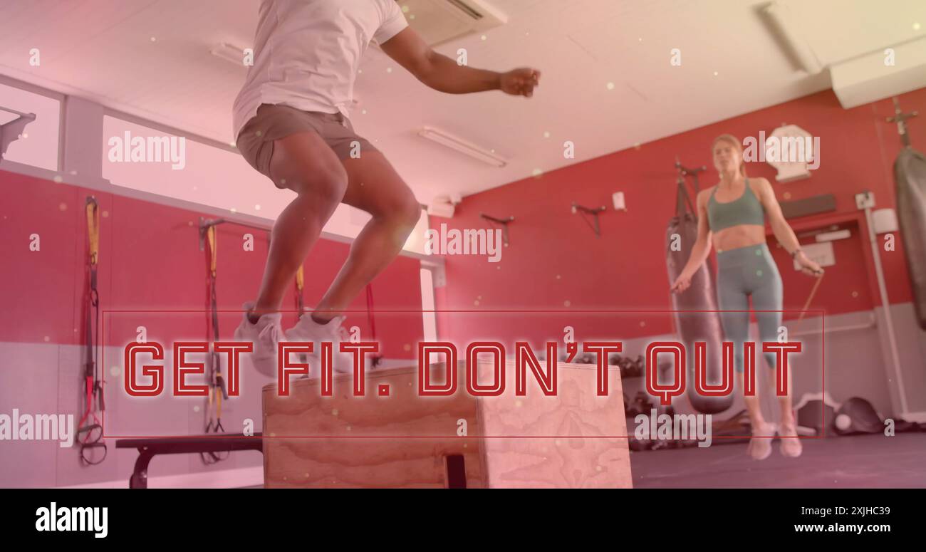 Image of get fit don't quit text over diverse man and woman exercising ...