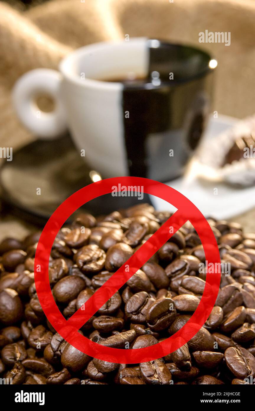 Coffee cup and coffee beans on canvas with warning crossed out sign ...