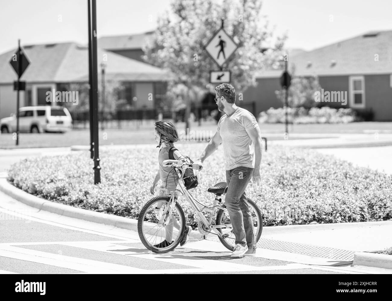 father and son on bicycle at fathers day. active father setting a ...