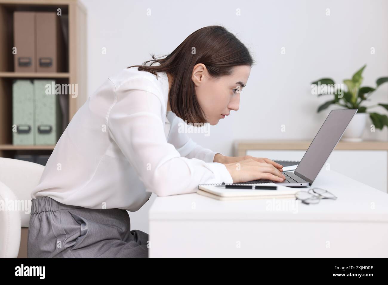 Woman poor posture working hi-res stock photography and images - Alamy