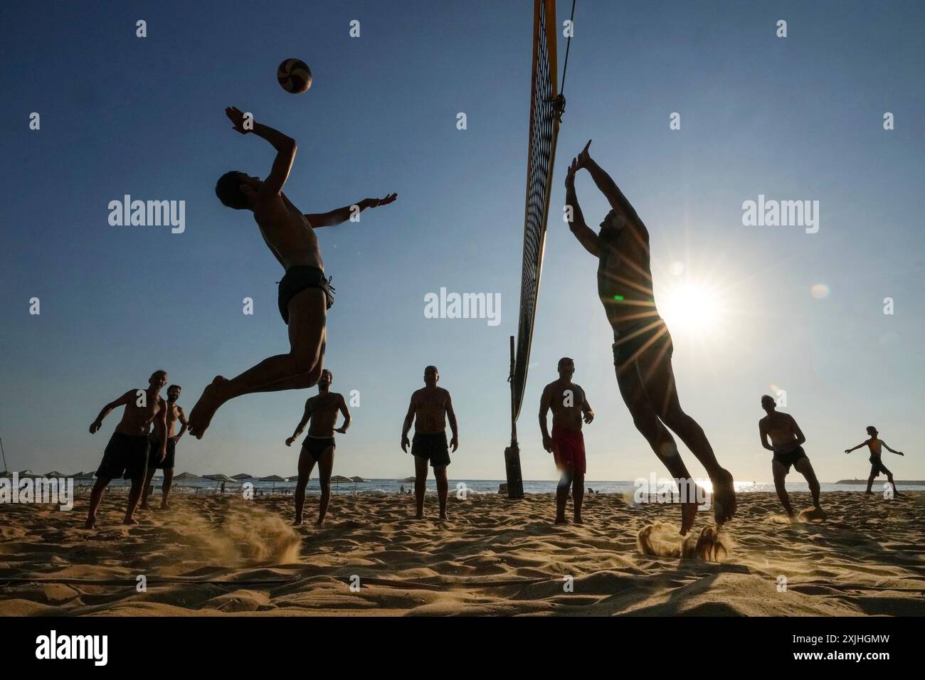 Men play volleyball on Ramlet al-Baida public beach in Beirut, Lebanon ...