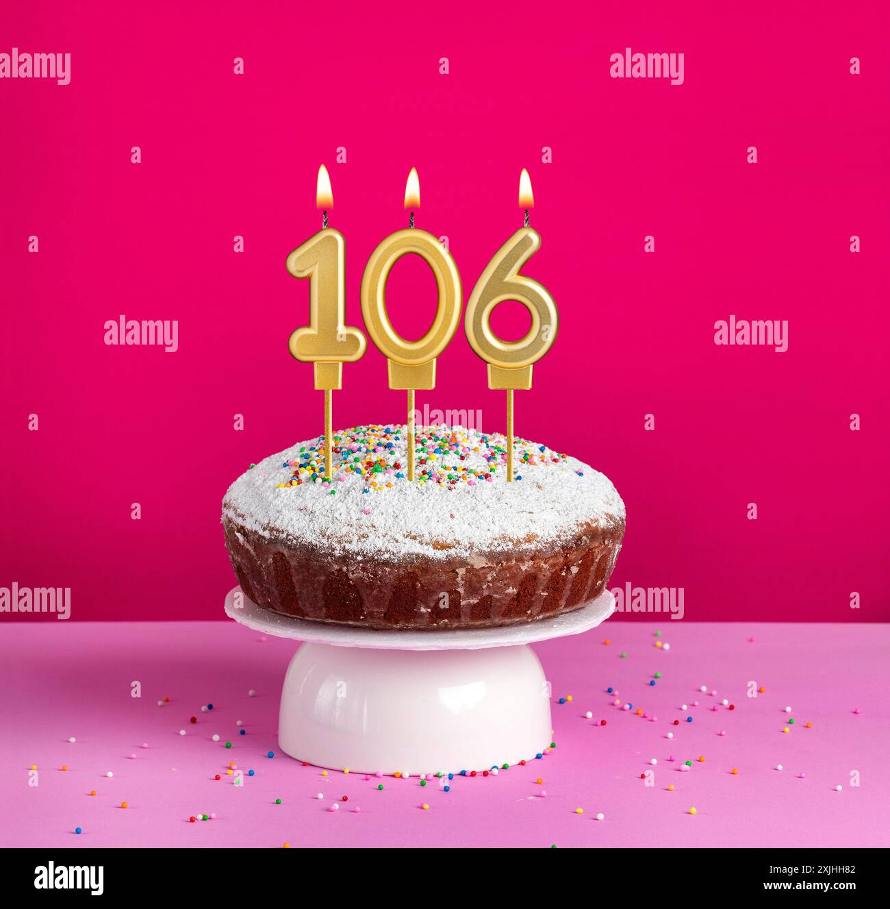 Lighted birthday candle number 106 - Birthday card on pink background ...