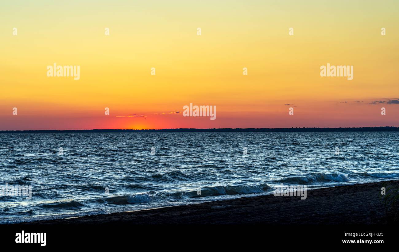 Sun setting over Lake Erie as seen from Northwest Beach at Point Pelee ...