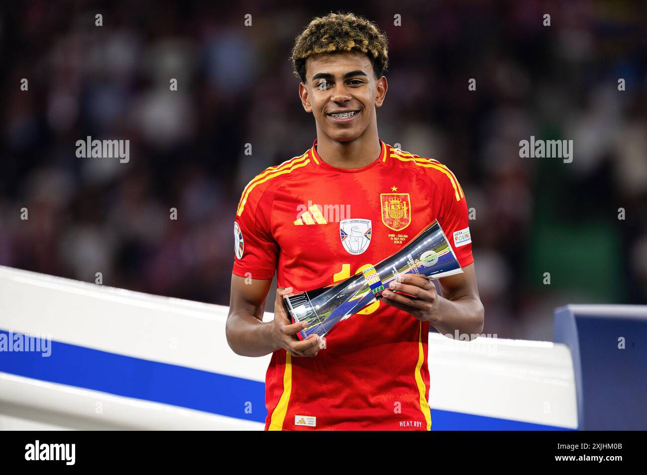 Berlin, Germany. 14th July, 2024. Lamine Yamal holds the award for the ...