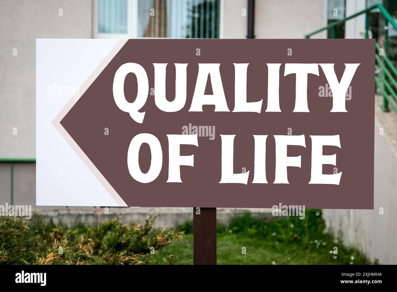 Quality of life. Direction arrow with text on the street Stock Photo ...