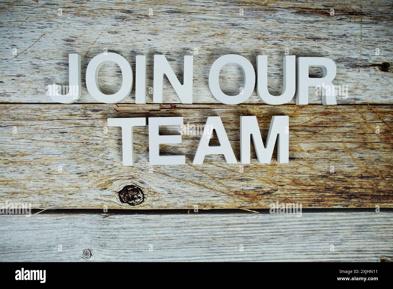 Join our team alphabet letters on wooden background Stock Photo - Alamy
