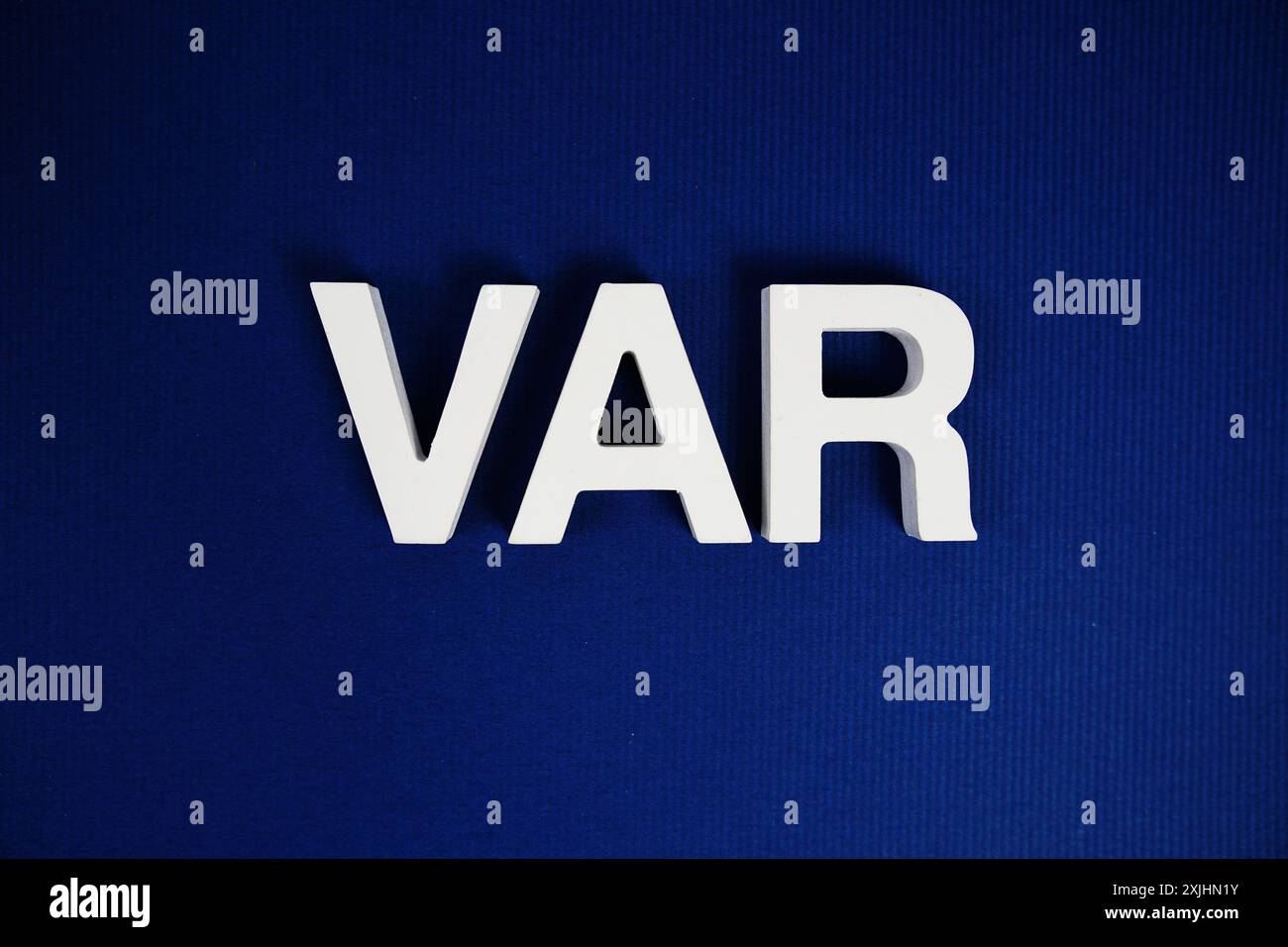 VAR (Video Assistante Referee) alphabet letters on blue background ...
