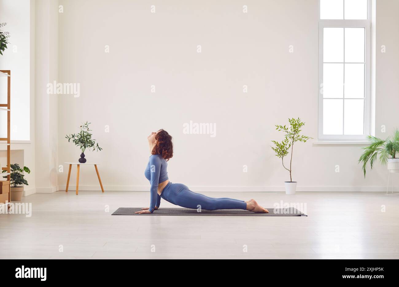 Yogi Attractive Woman Practicing Yoga Stretching In Urdhva Mukha