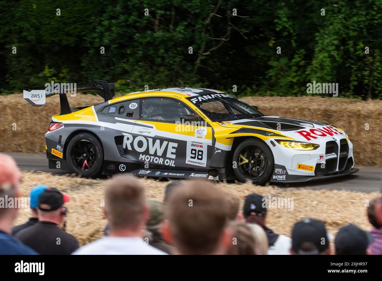 2022 BMW M4 GT3 car driving up the hill climb track at the Goodwood Festival of Speed 2024 ...