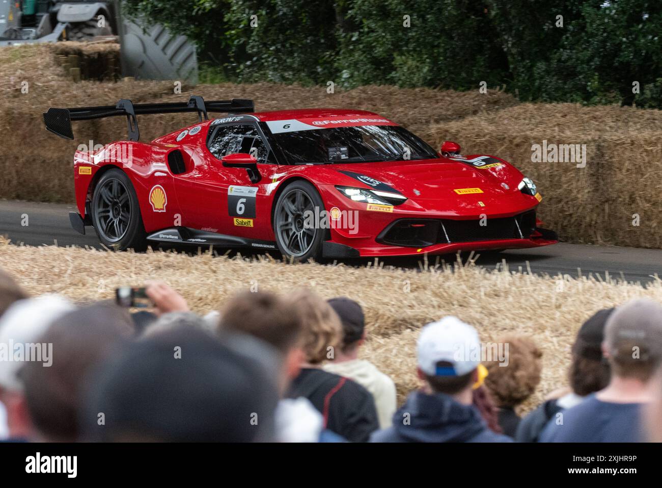 2024 Ferrari 296 Challenge car driving up the hill climb track at the ...
