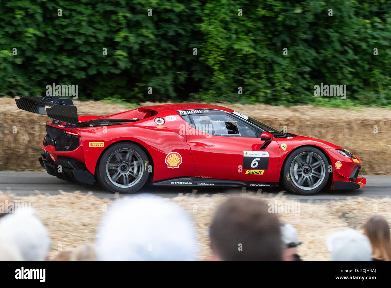 2024 Ferrari 296 Challenge car driving up the hill climb track at the ...