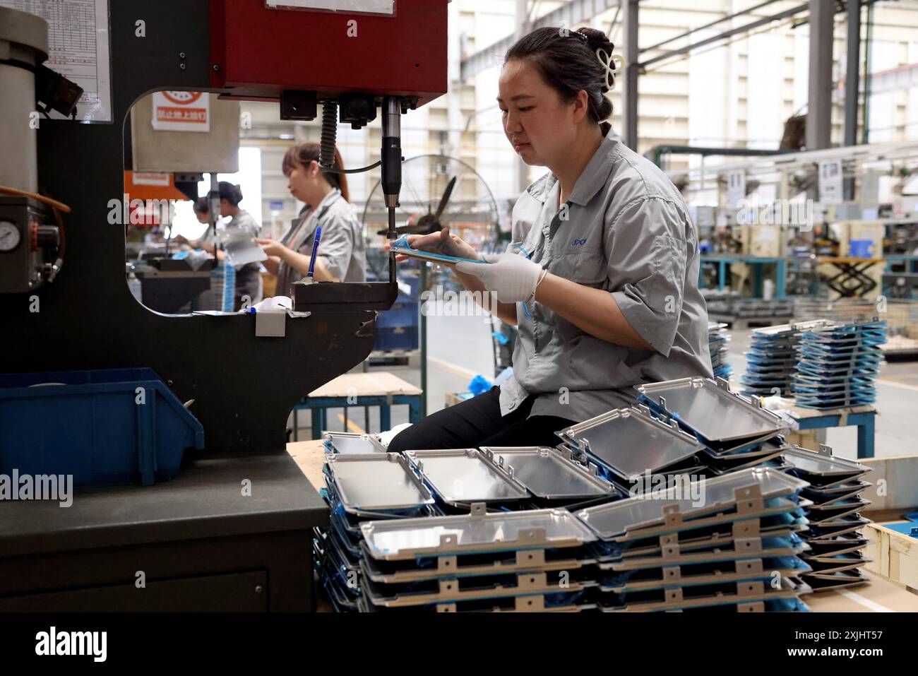 FUZHOU, CHINA - JULY 17, 2024 - Workers are making battery pack ...
