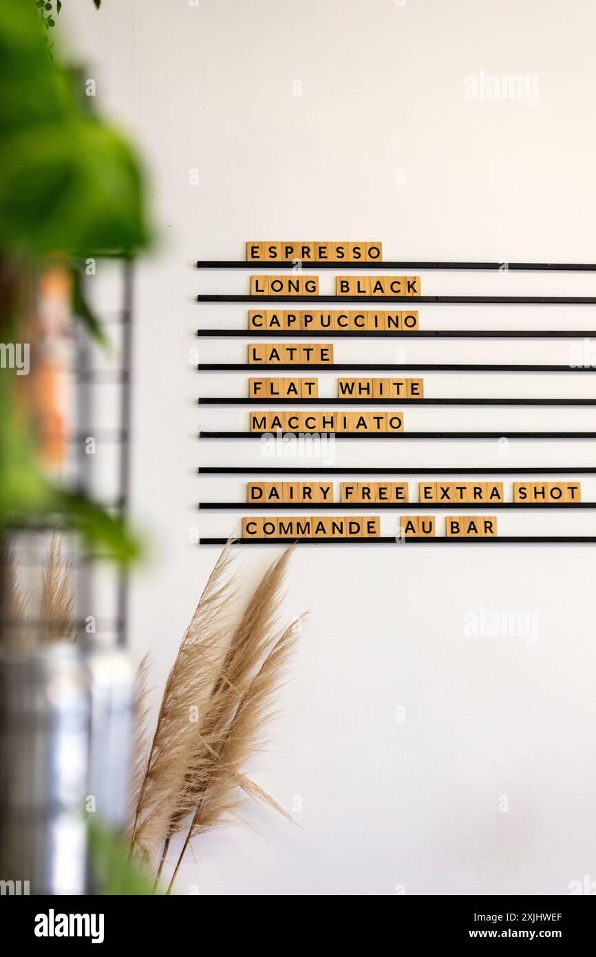 Wooden coffee menu on the wall in a cafe Stock Photo - Alamy