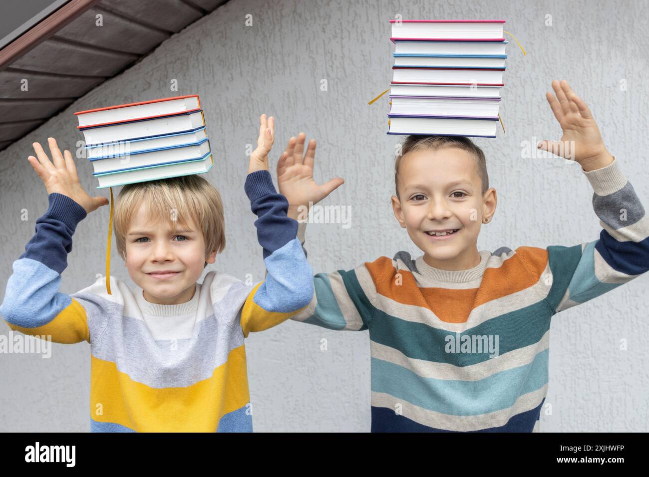 Two elementary students reading book hi-res stock photography and ...
