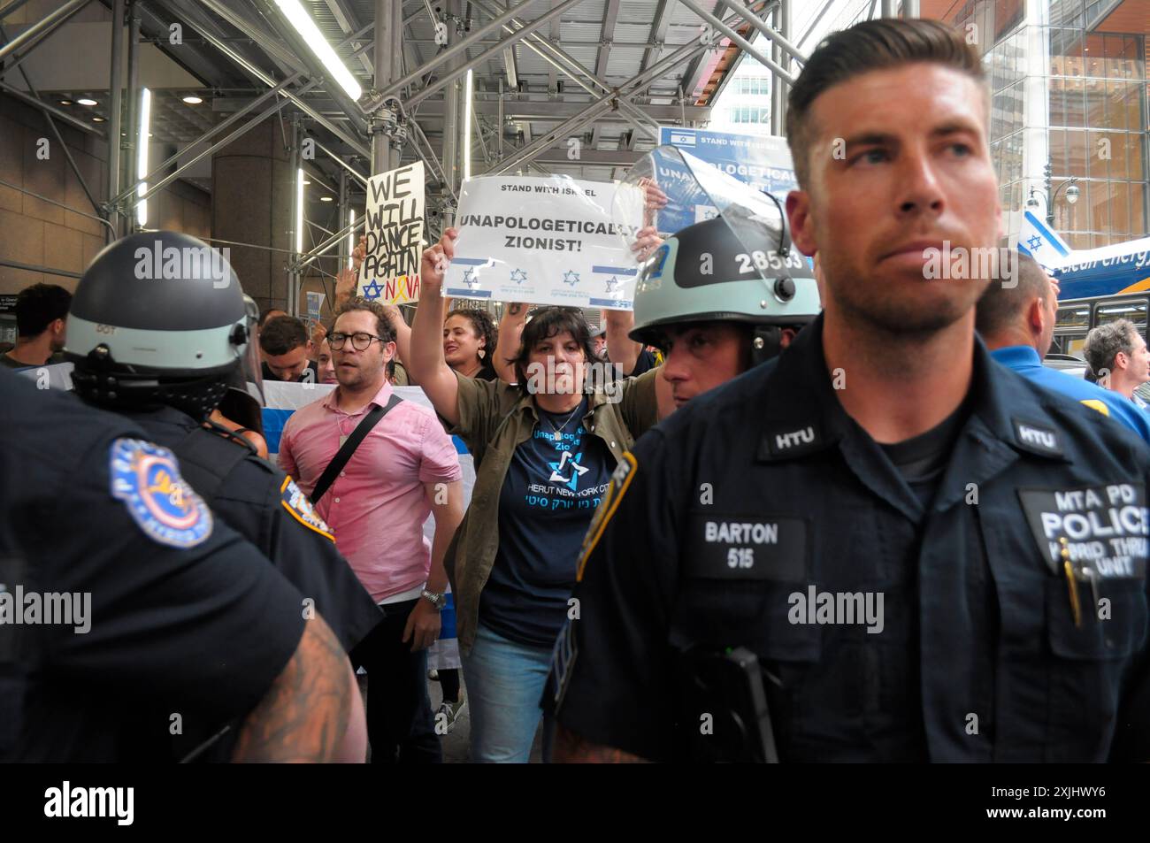 Pro-Israel counter-demonstrators, center, rally near a pro-Palestine ...