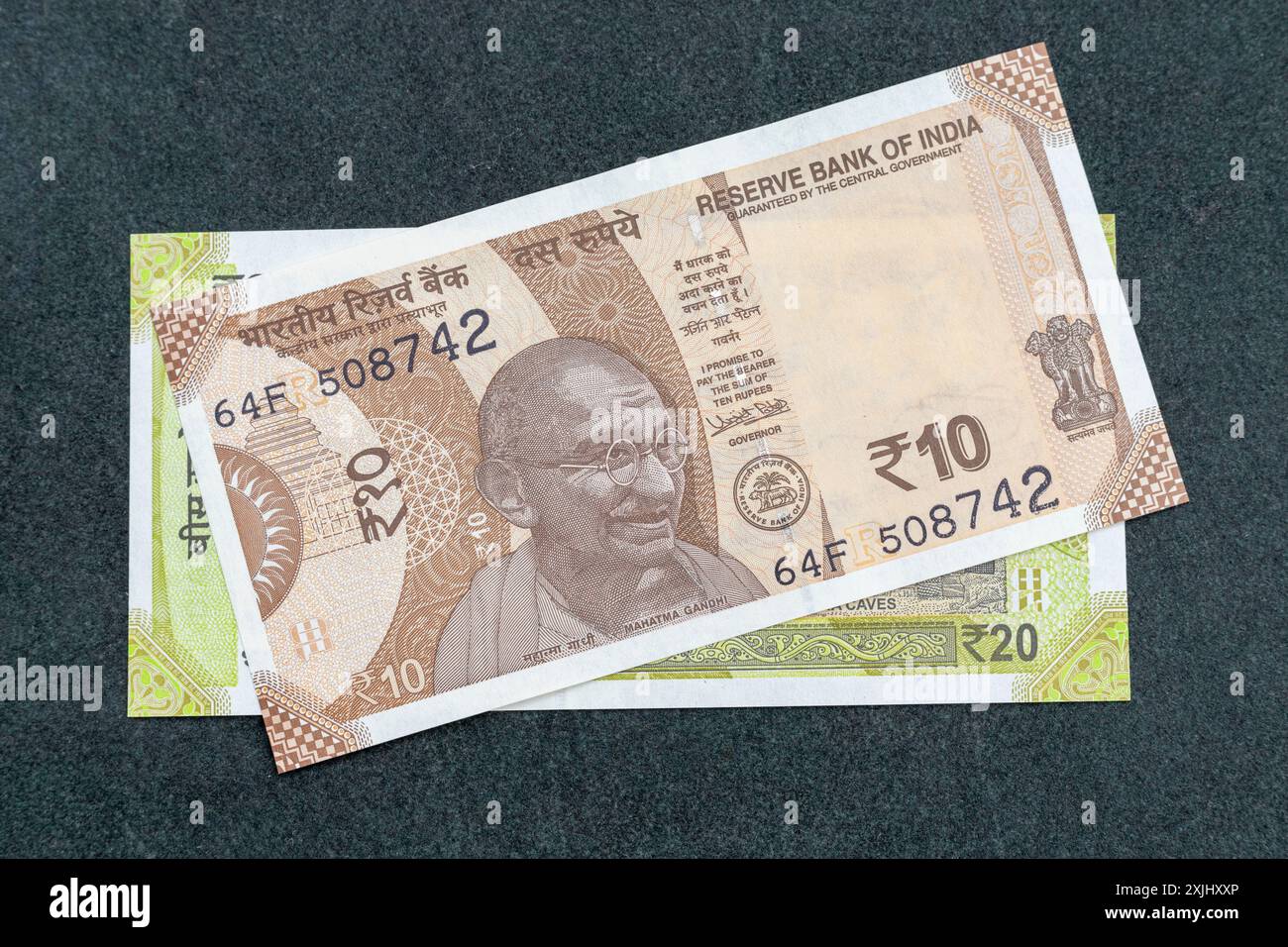 Two new currency bank notes of ten and twenty with a Mahatma Gandhi ...