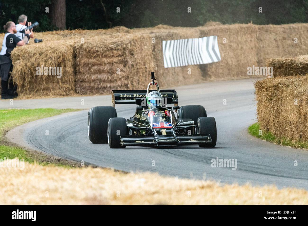 1976 Lotus-Cosworth 77 Formula 1 racing car driving up the hill climb ...