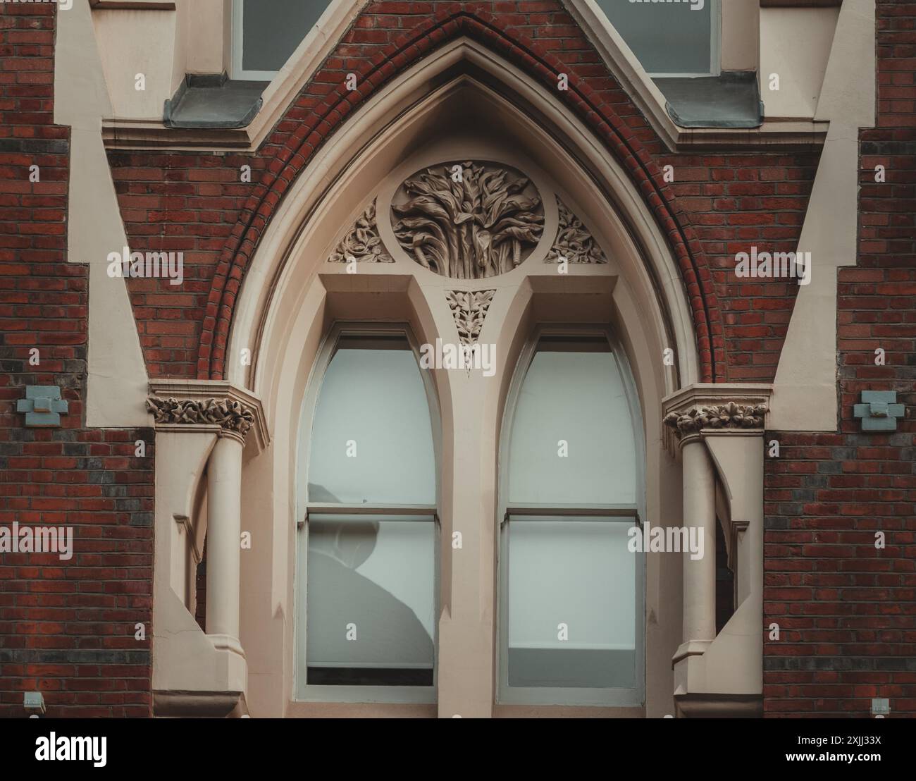 Ornate arched window in a brick building in London, UK Stock Photo - Alamy