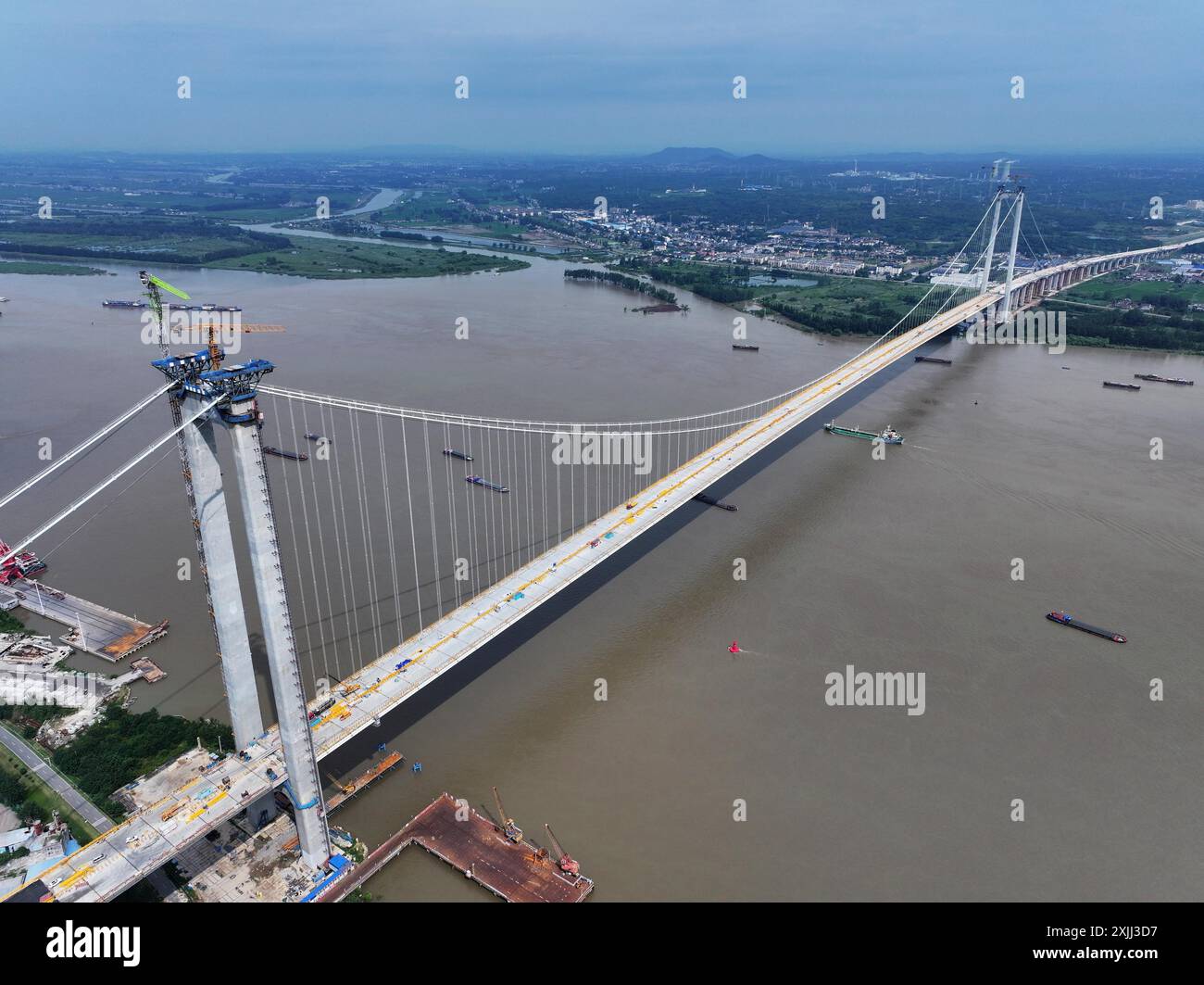 Aerial photo shows the Longtan Yangtze River Bridge under construction ...