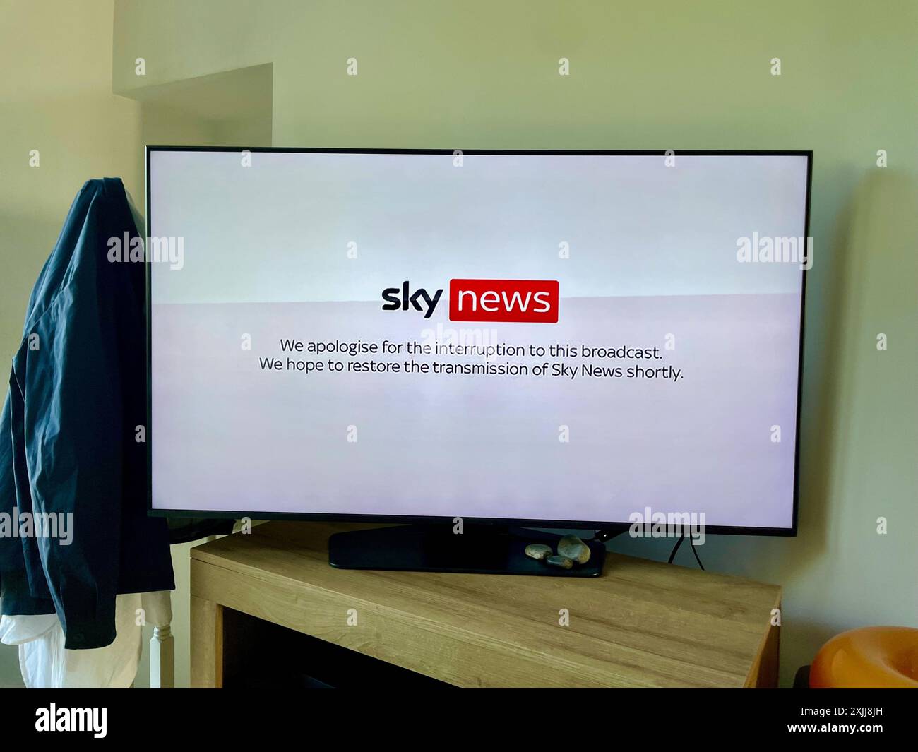 Sky news homepage on a television; Microsoft outage linked to cyber ...
