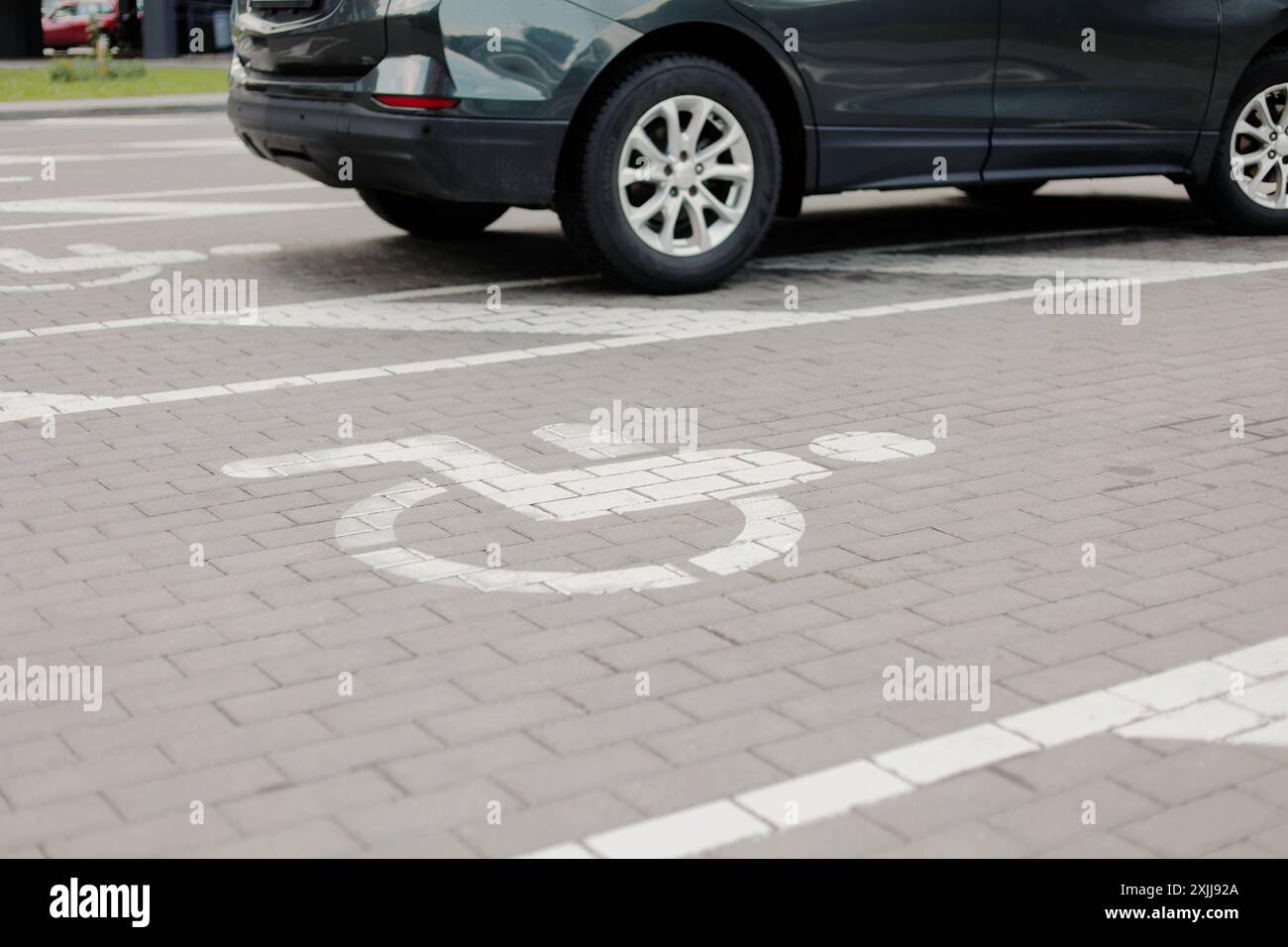 Car parking near disabled parking sign area at asphalt parking lot ...