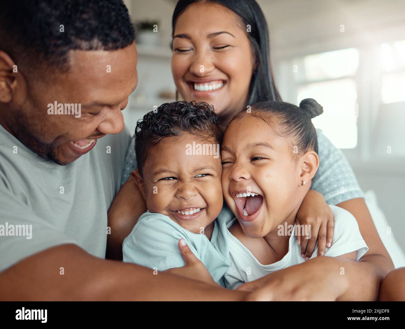 Parents, children and laughing or having fun together for bonding ...