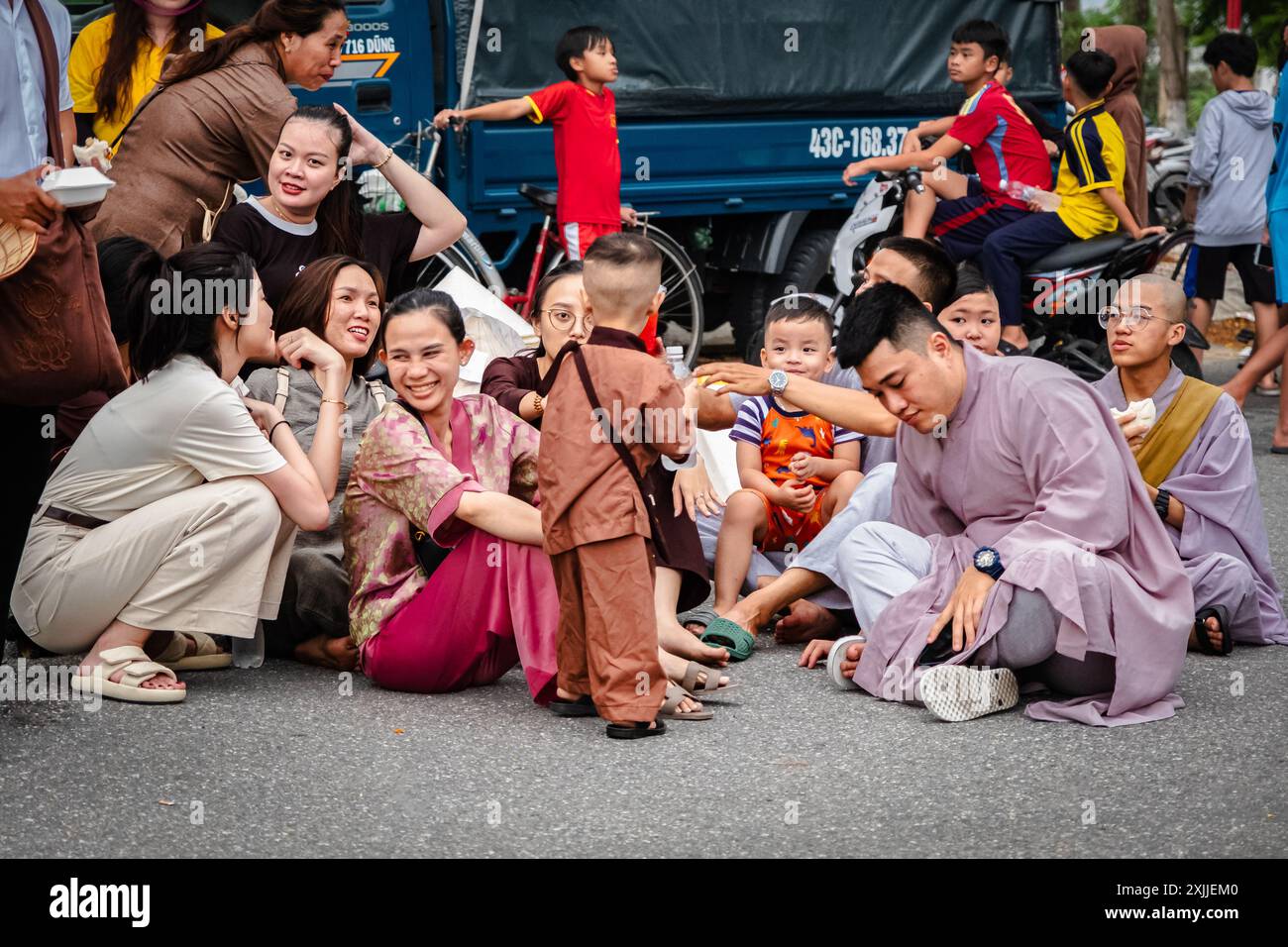 Vietnamese people, family having their meals sitting on the ground ...