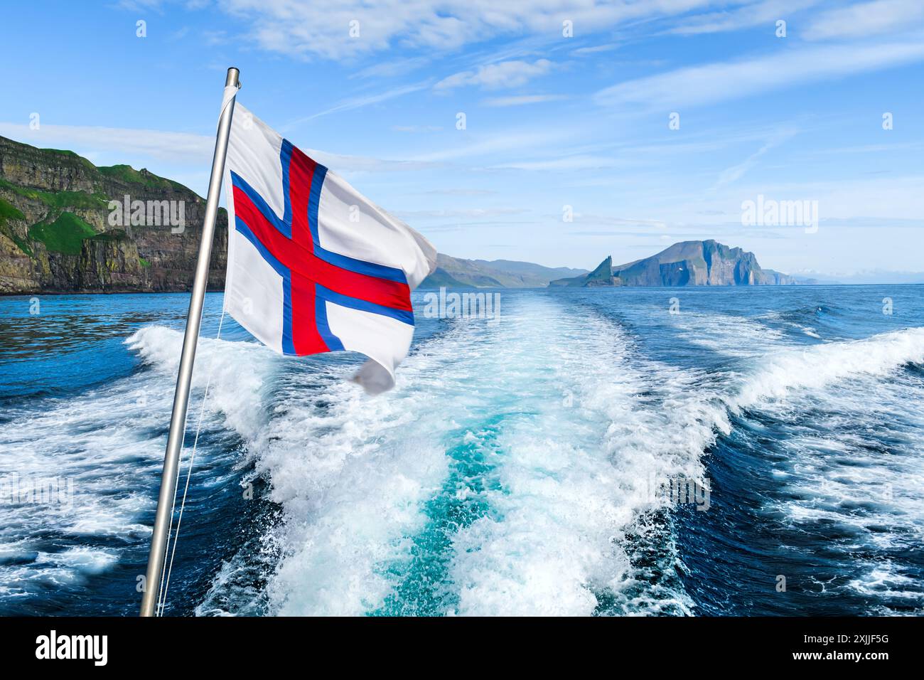 View of the Atlantic ocean and Faroe Islands from a boat sailing from ...