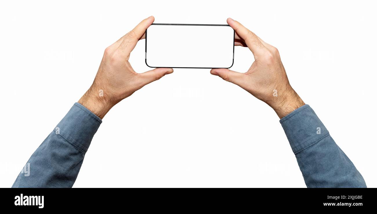 Isolated male's hands with blue sleeves holds mobile phone with empty ...