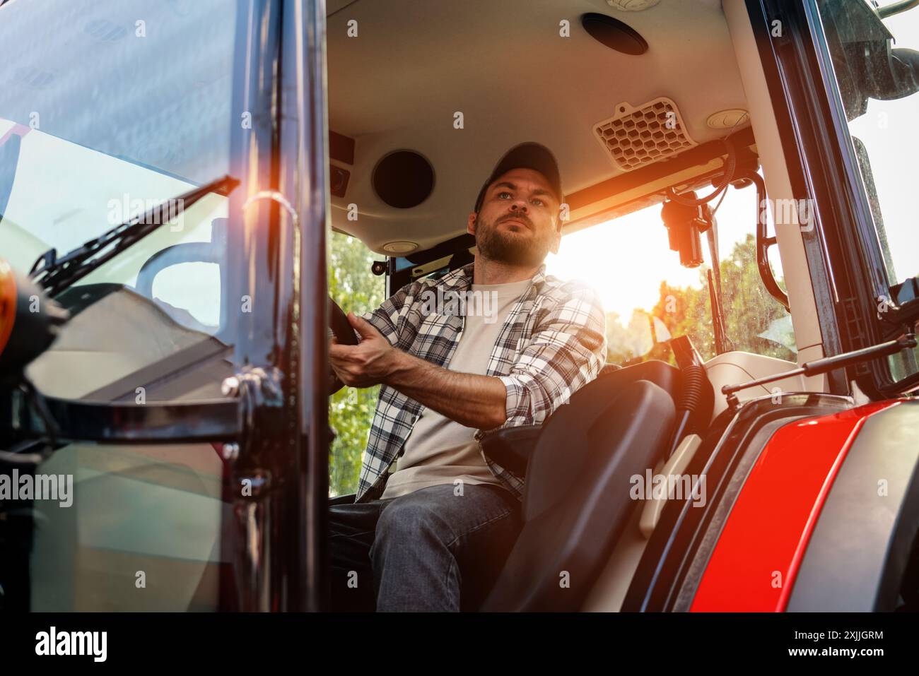 Man driving tractor hi-res stock photography and images - Alamy