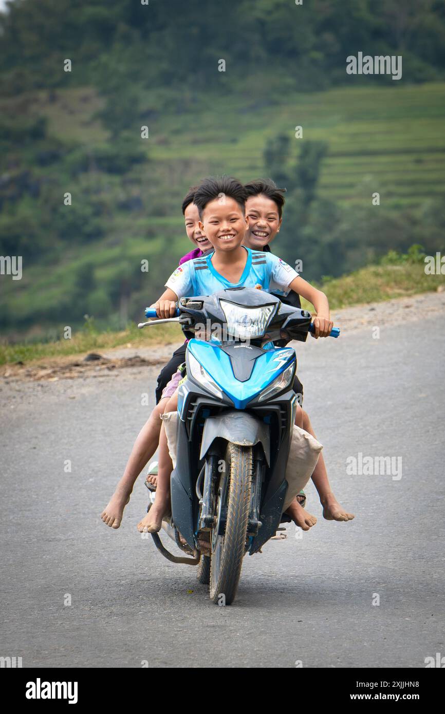 Three happy boys riding on a motorcycle in Lao Cai Province, Northern ...