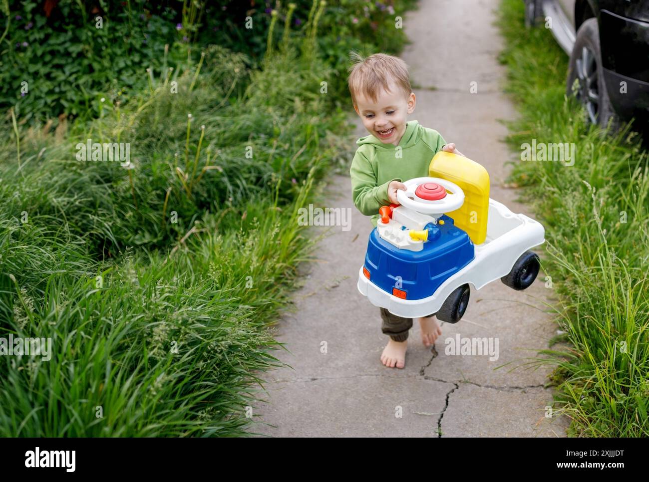 Happy kid enjoying outdoor playtime Stock Photo - Alamy